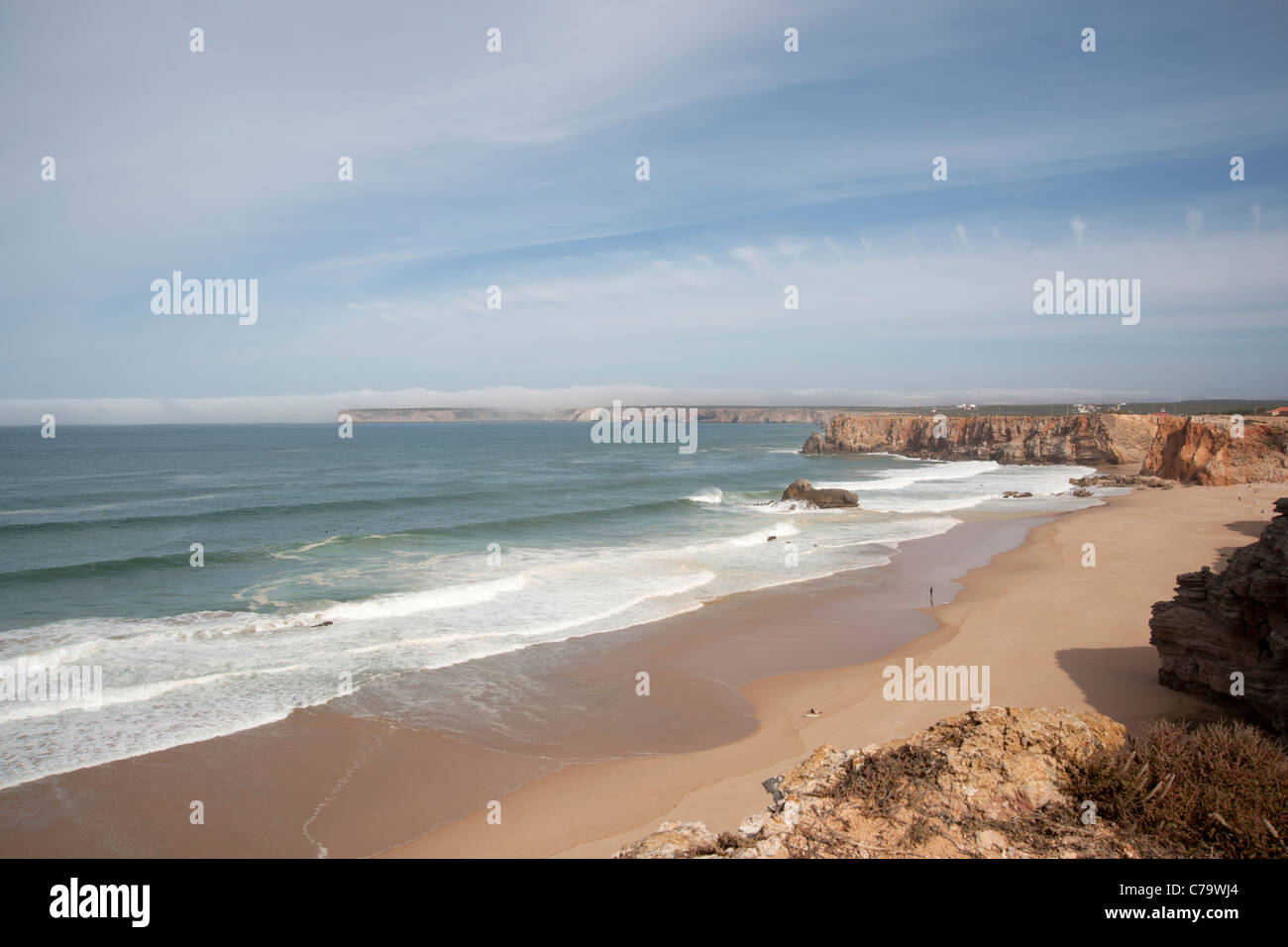 Lone surfer watching waves at Tonel beach, Portugal Stock Photo - Alamy