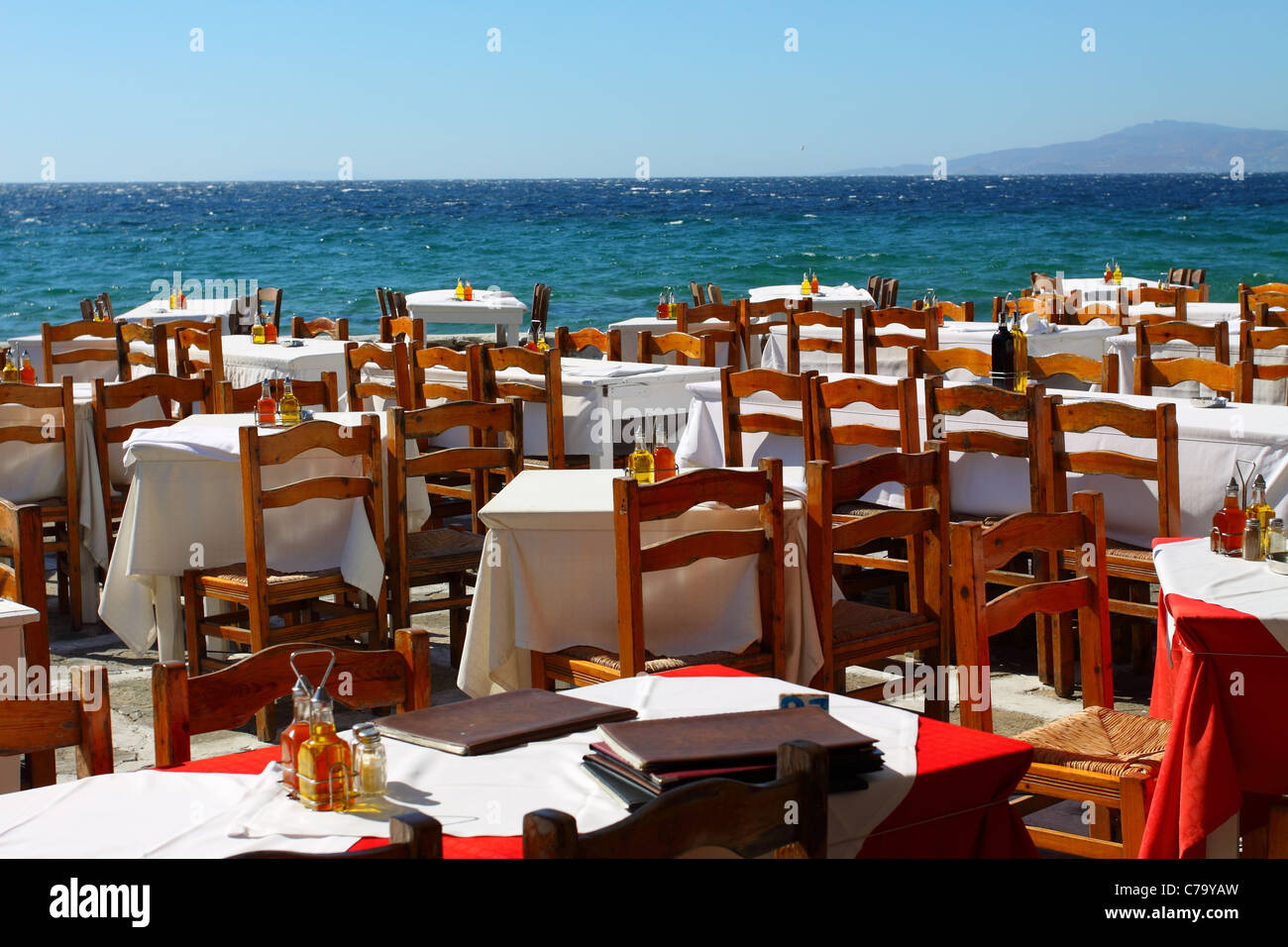 Restaurant by seaside in Mykonos, Greece Stock Photo - Alamy