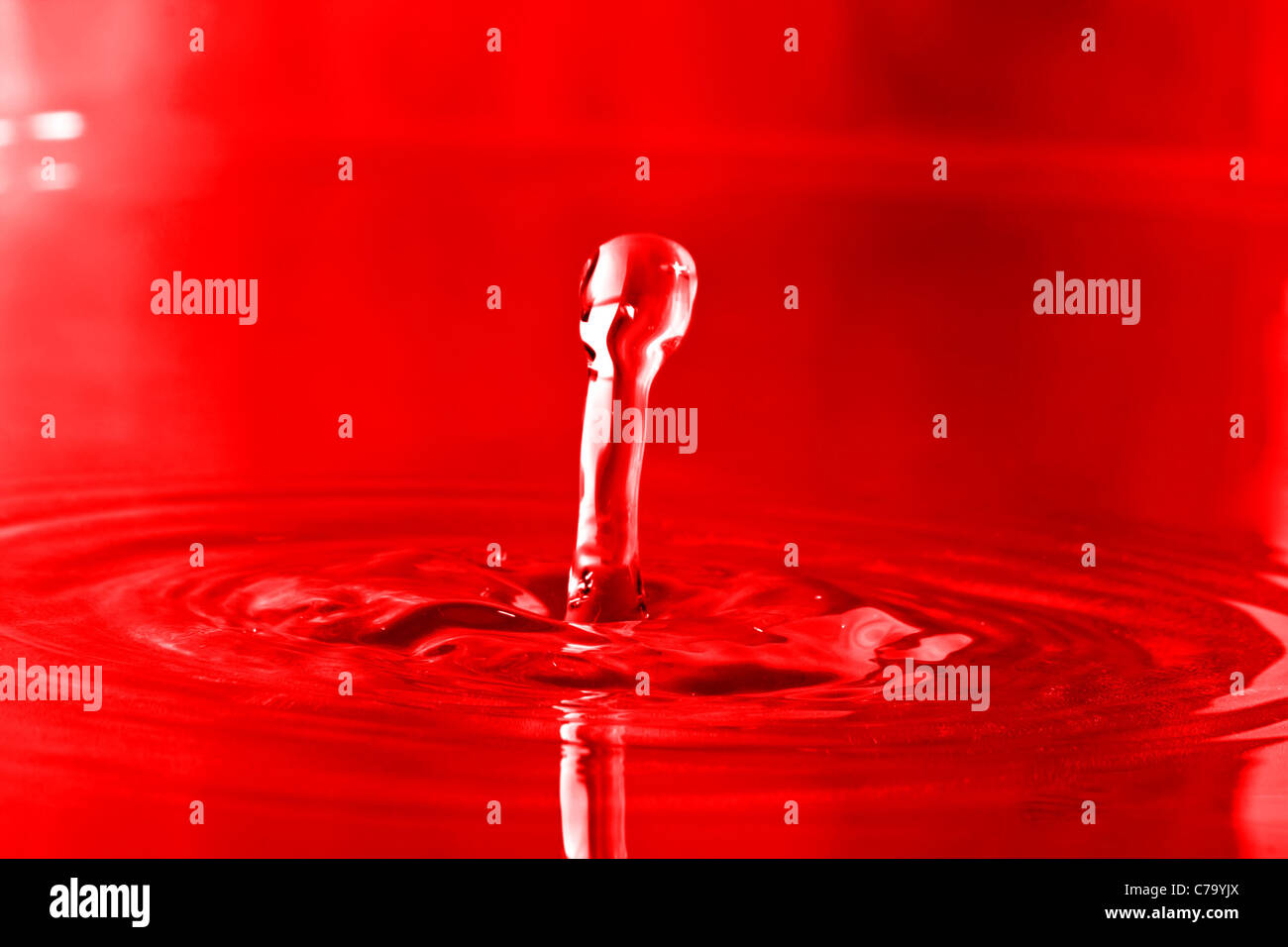 A red liquid background with circular swirls and ripples that works as ...