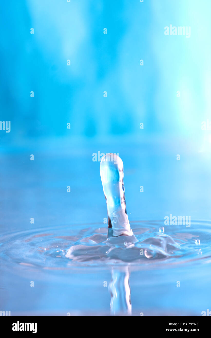 A blue water droplet splash background. Shallow depth of field Stock ...
