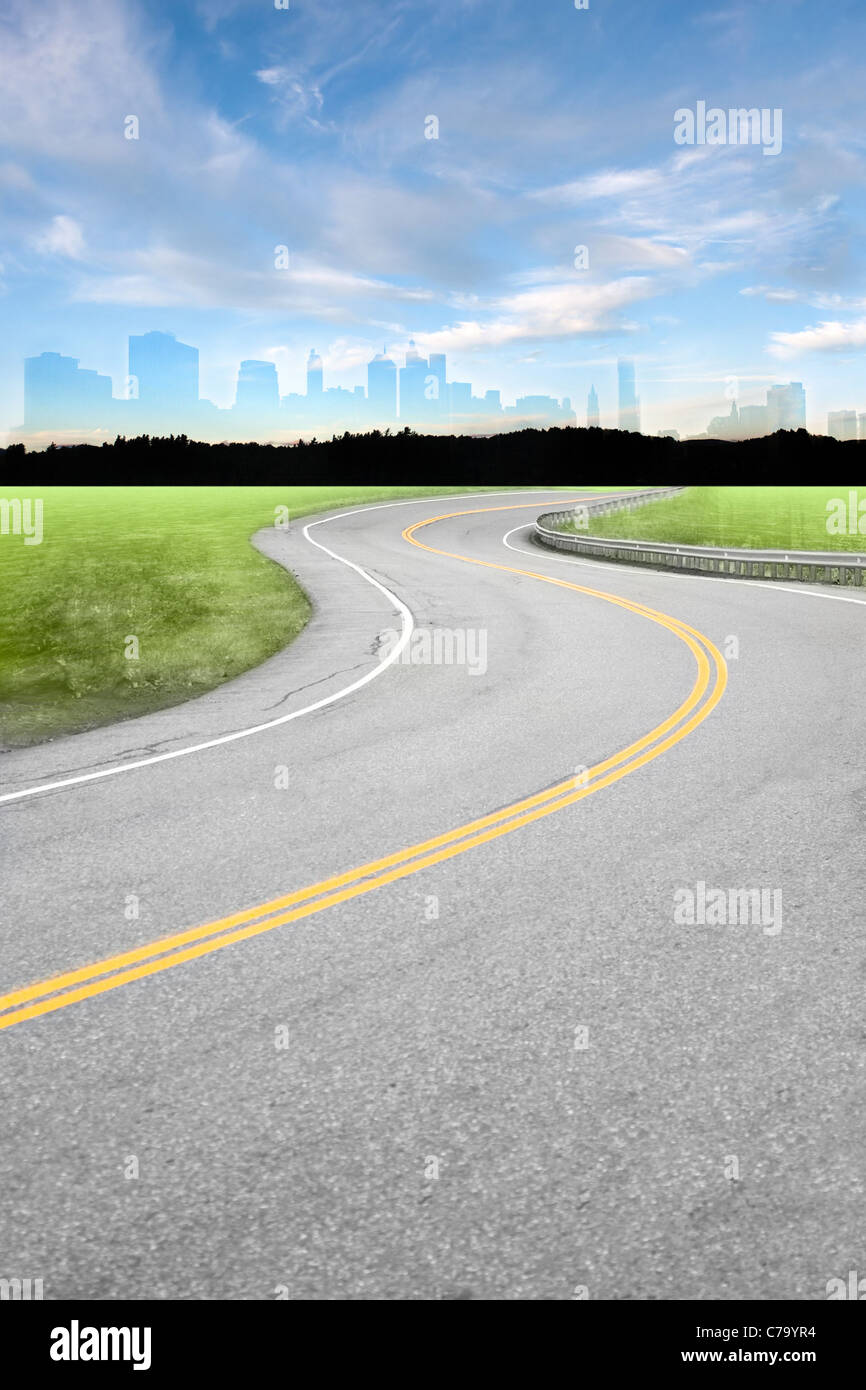 An empty curved road leading off into the horizon of trees and ...