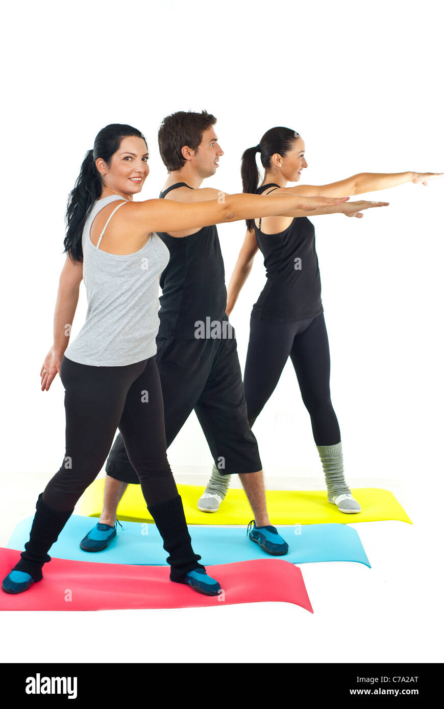Full length of three people doing fitness over white background Stock ...