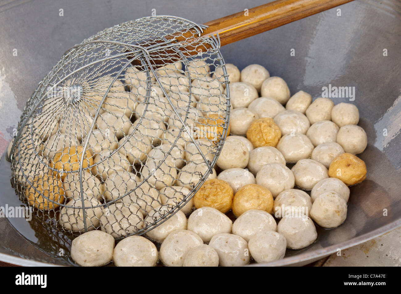 Fish meat ball fry in pan at market of Thailand Stock Photo - Alamy