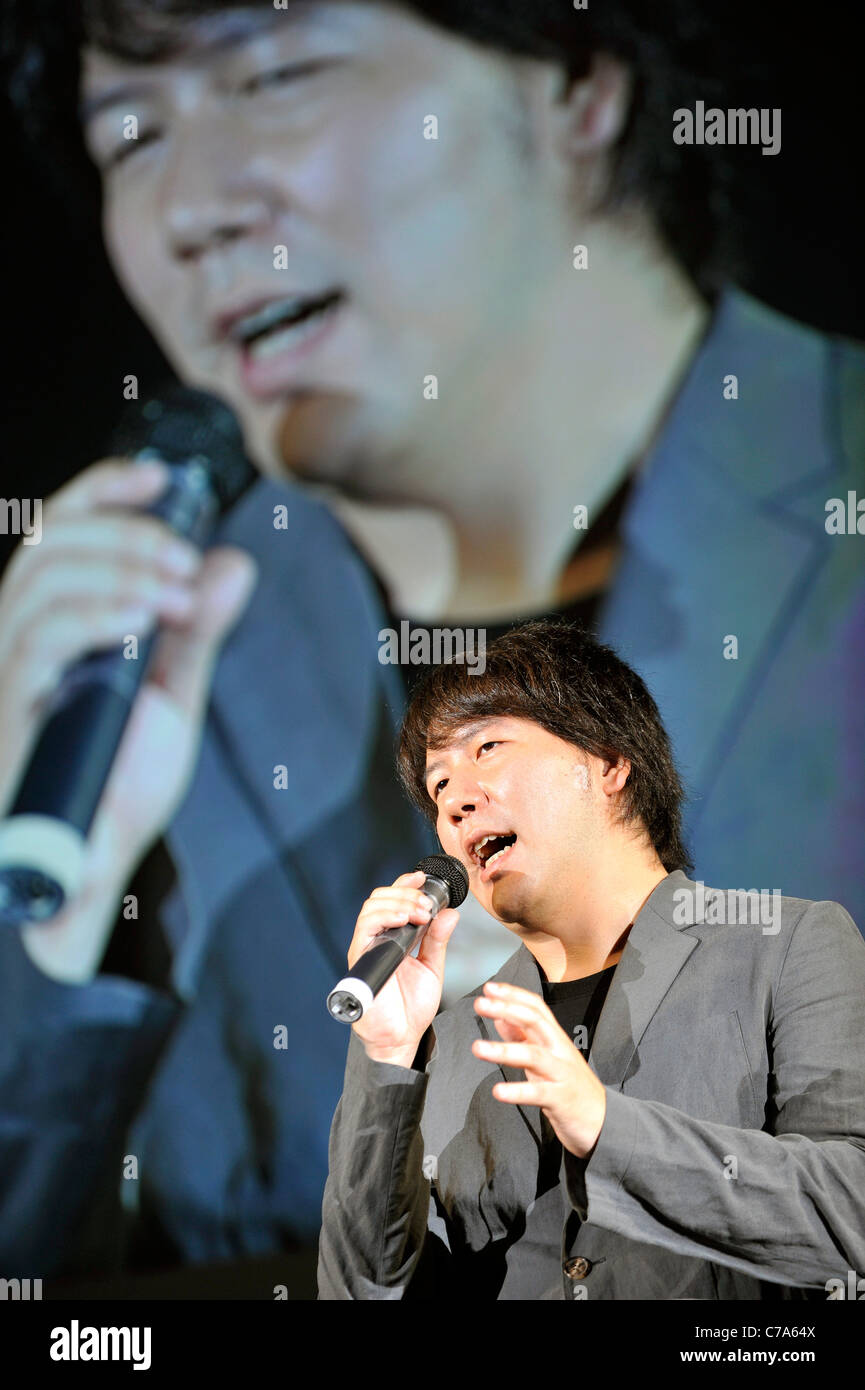 Yoshikazu Tanaka, president and CEO of GREE, Inc., speaks during a ...