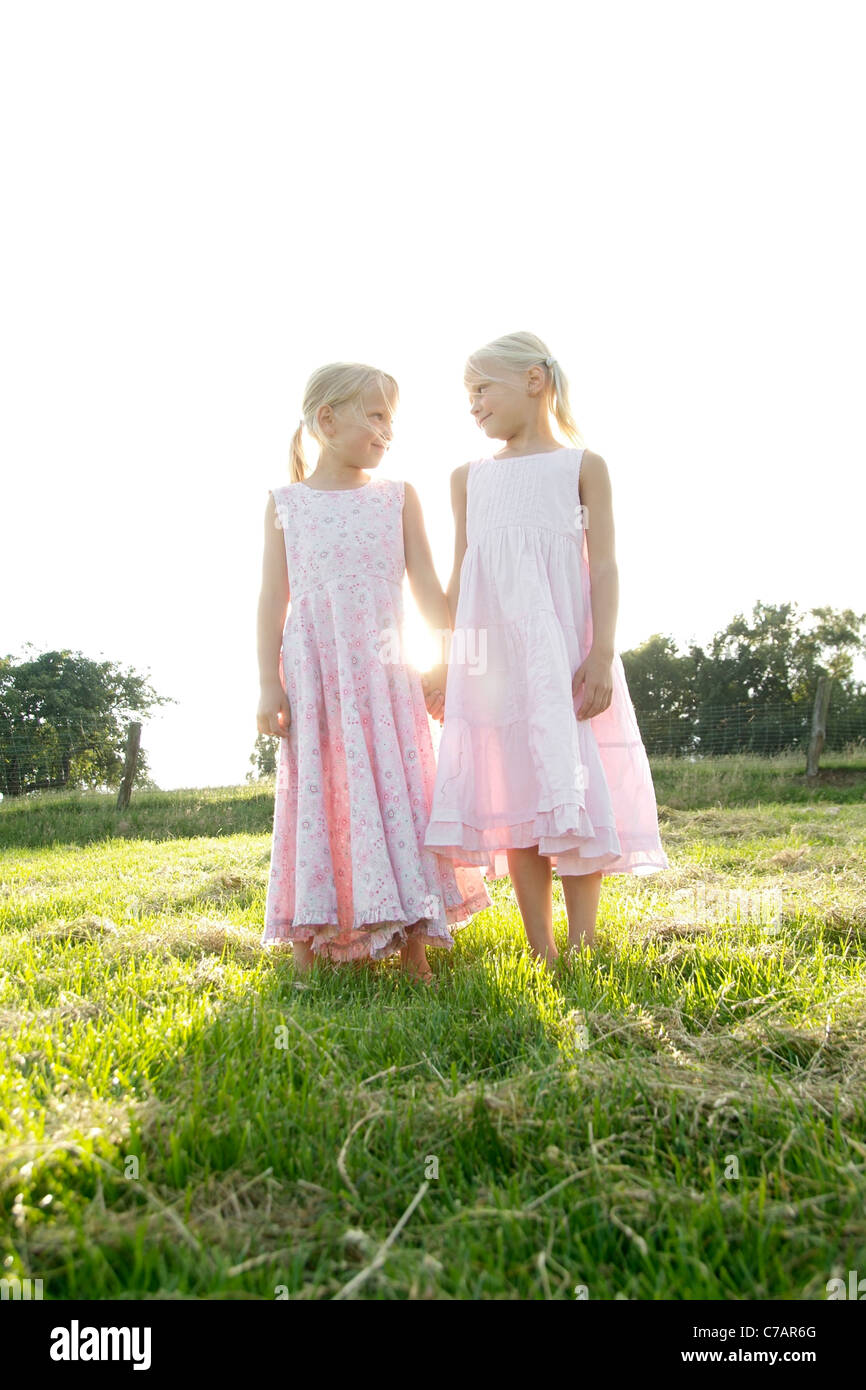 Portrait of two girl friends holding hands in summer, Eyendorf, Lower ...