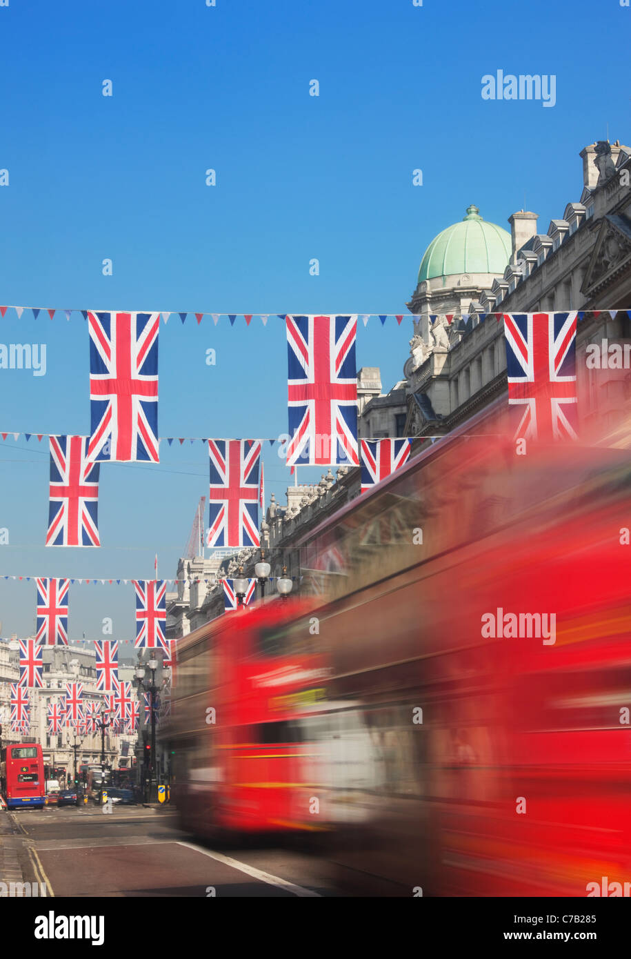 Red buses and Union Jack Flags on Regent Street; London; England Stock ...