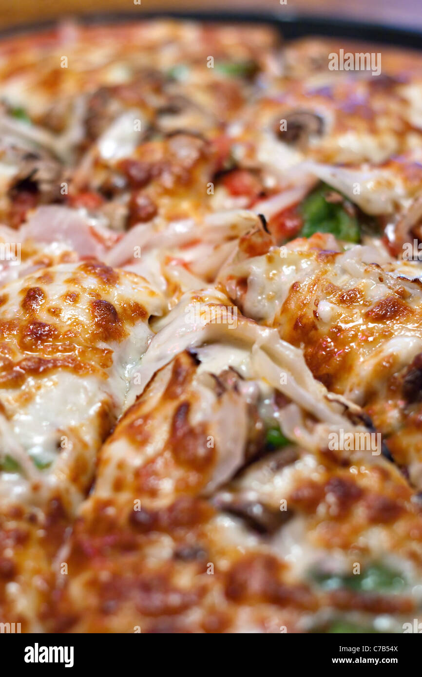 A fresh homemade specialty pizza with extra toppings hot and fresh out ...