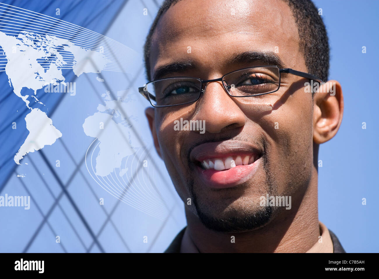 A smiling African American man over a world map conceptual background ...