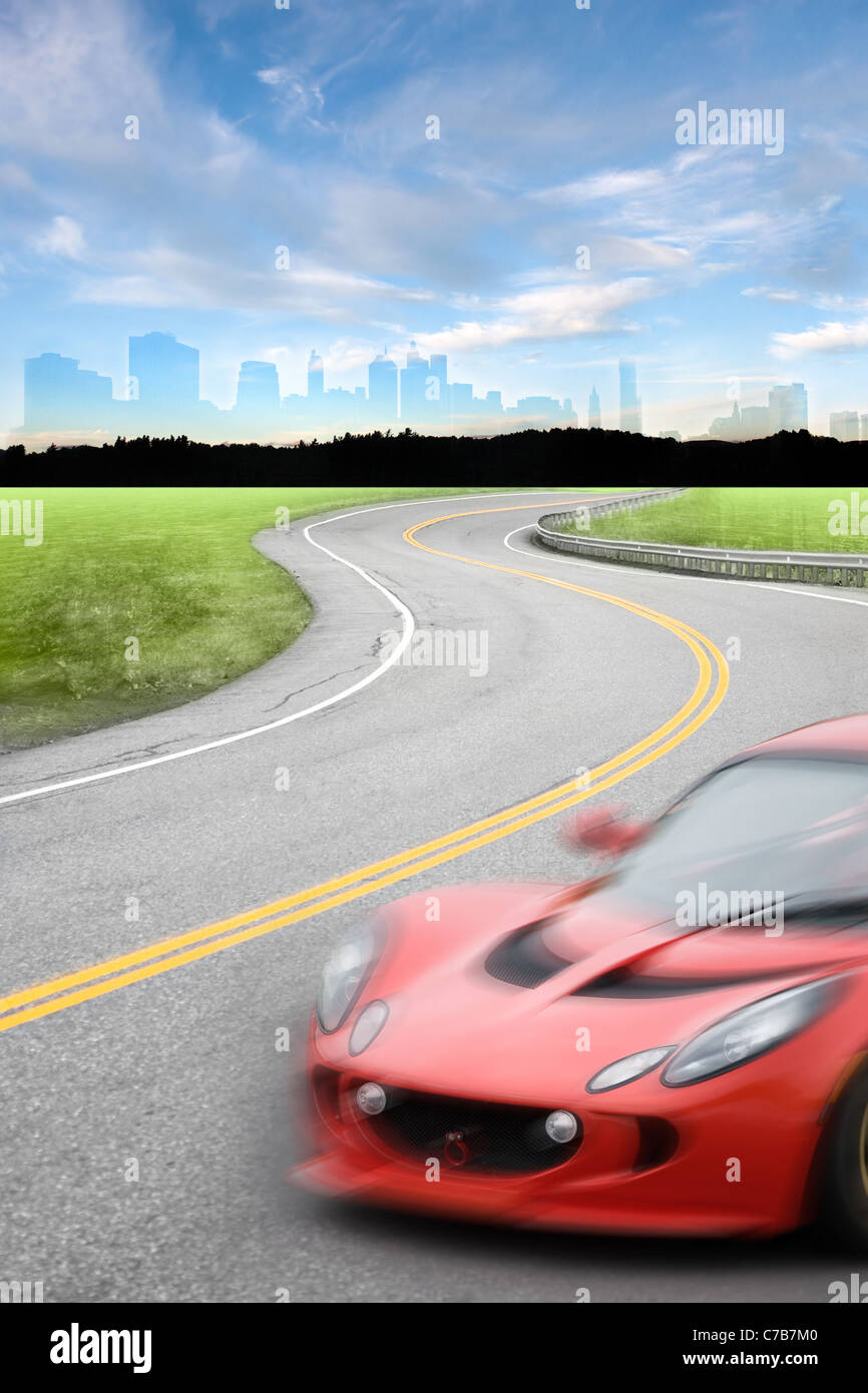 Road scene with a speeding car with motion blur driving down a winding ...