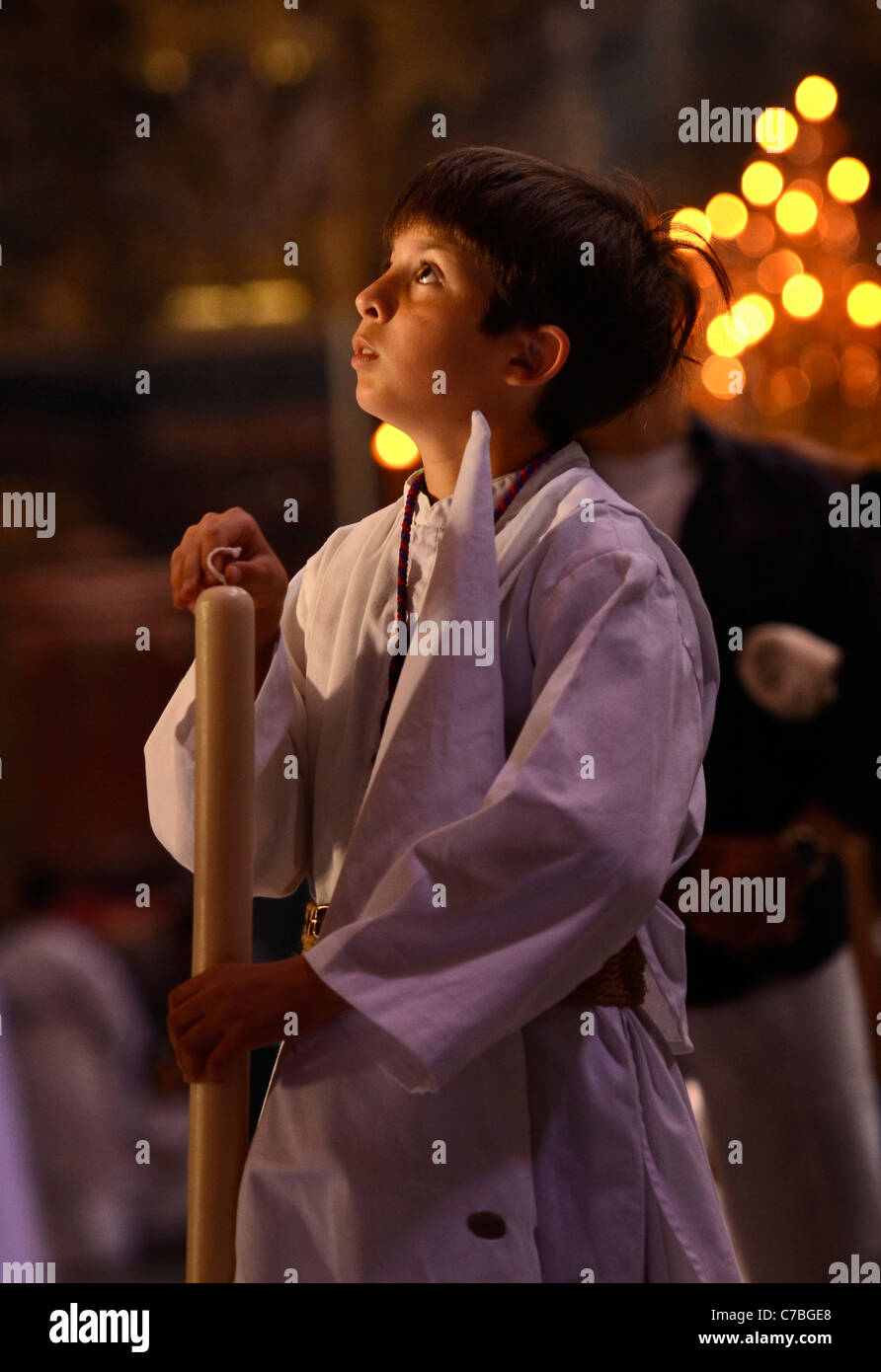 Boy in white cowl at the church El Salvador on Palm Sunday Brotherhood ...