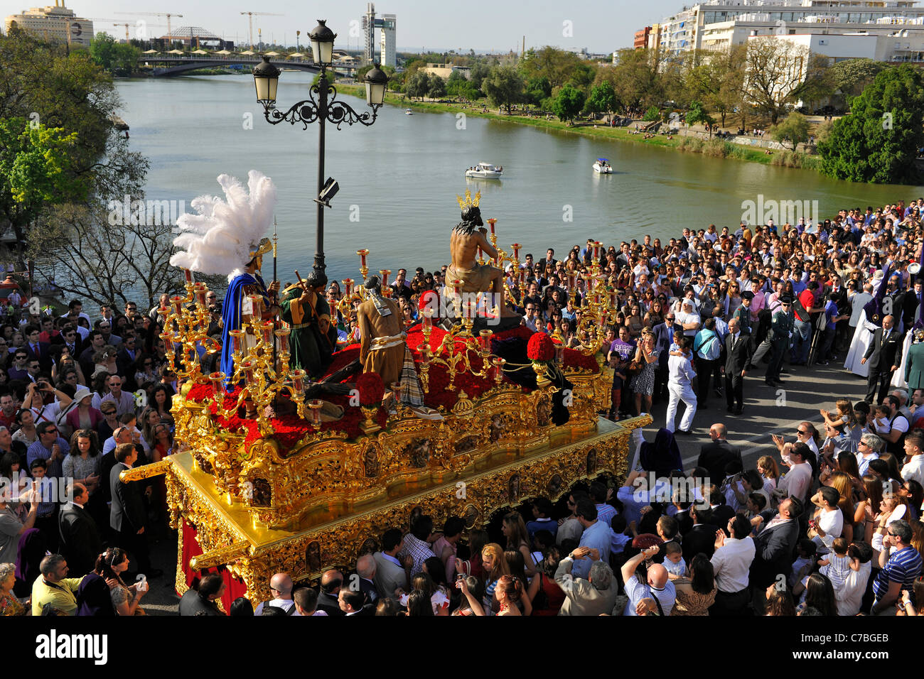 Crowd and brotherhood La Estrella during procession on Palm Sunday ...