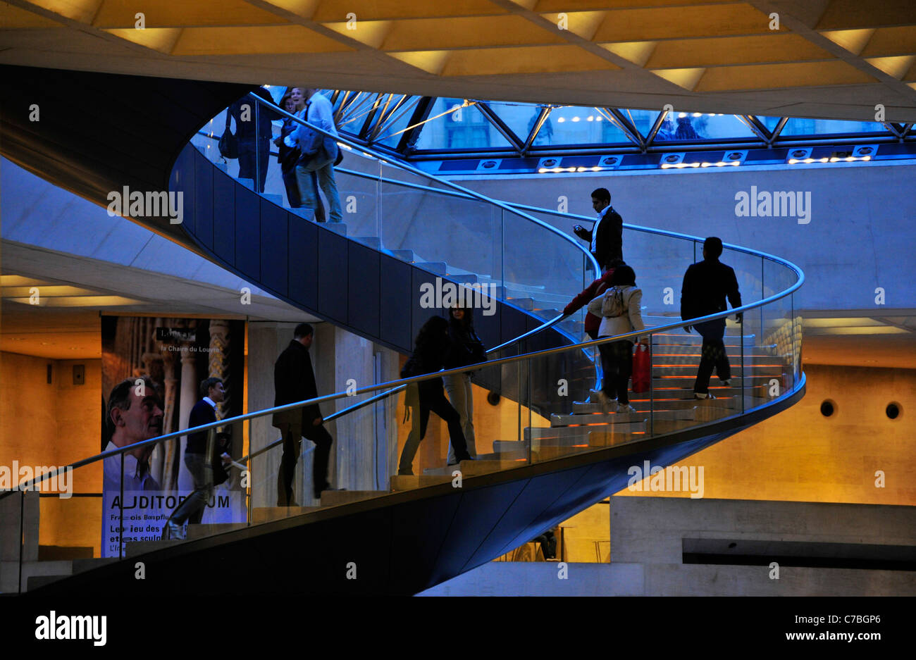 People on spiral staircase inside of Louvre pyramid, Paris, France ...