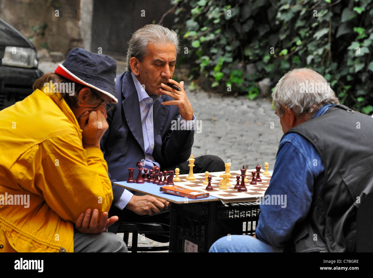 Mature men playing chess outdoors hi-res stock photography and images ...