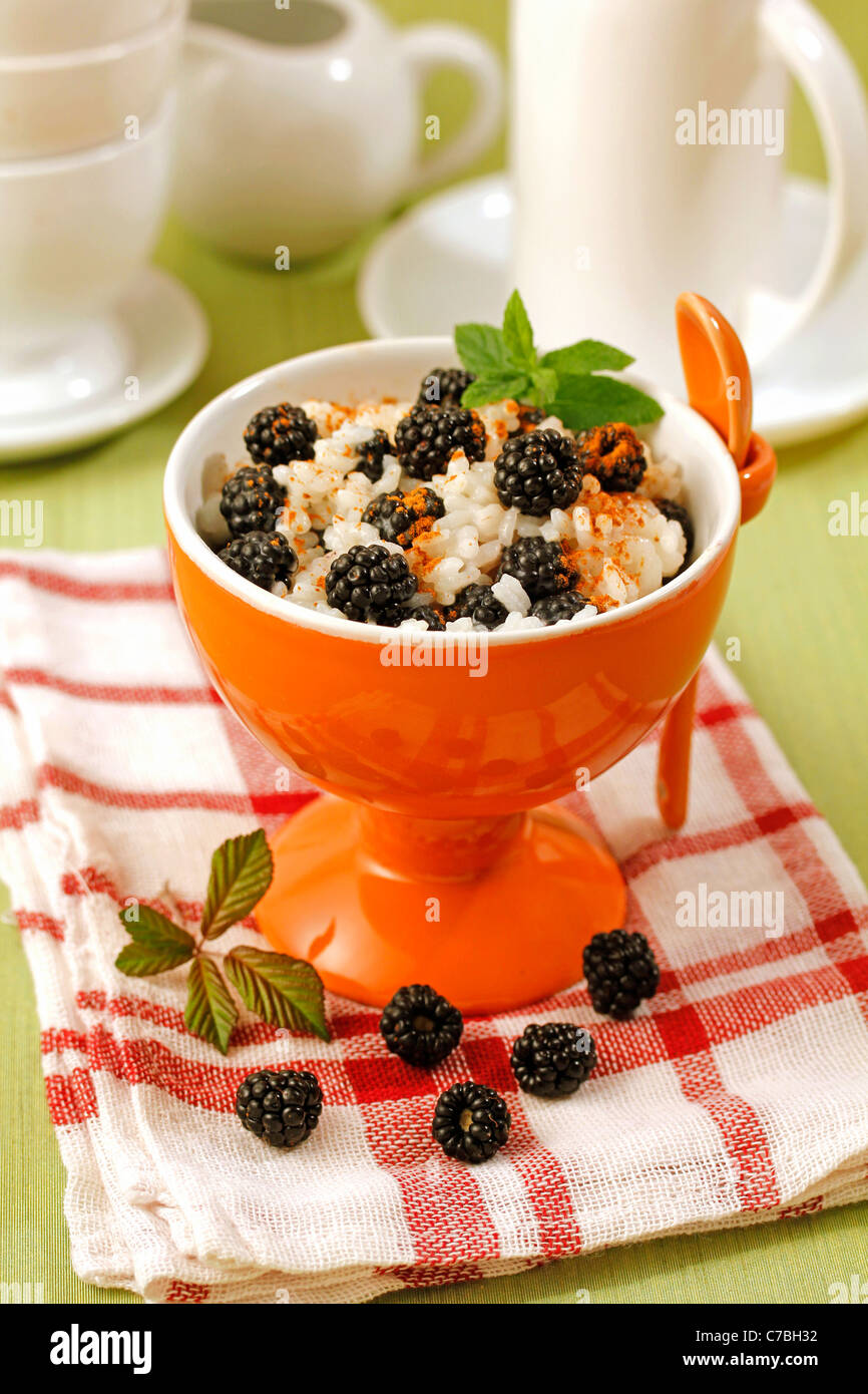 Creamed rice with blackberries. Recipe available Stock Photo - Alamy