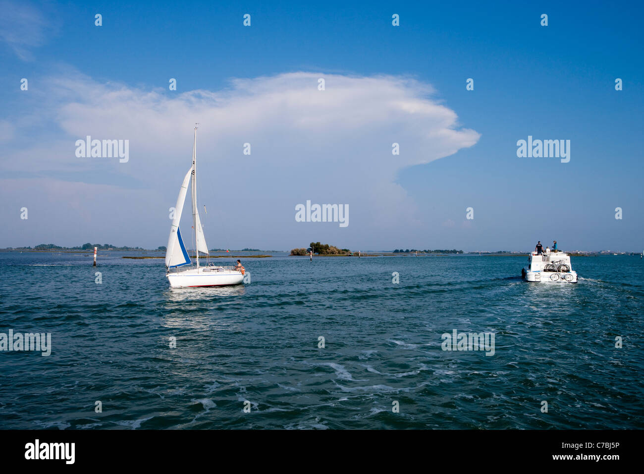 Sailing boat and Le Boat Magnifique houseboat in Laguna di Grado lagoon ...