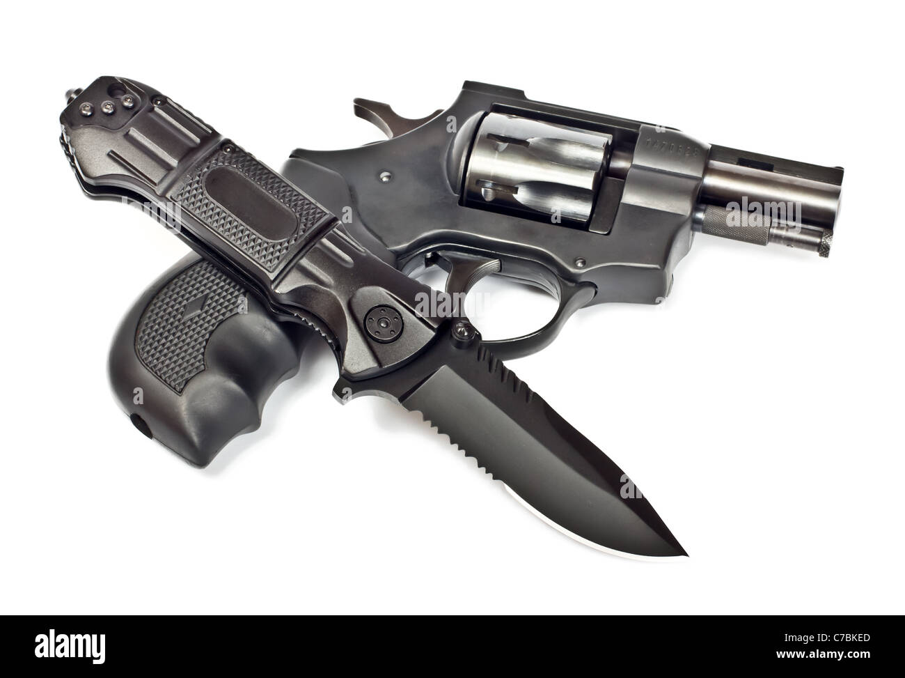 Knife and revolver. Isolated on white background Stock Photo - Alamy