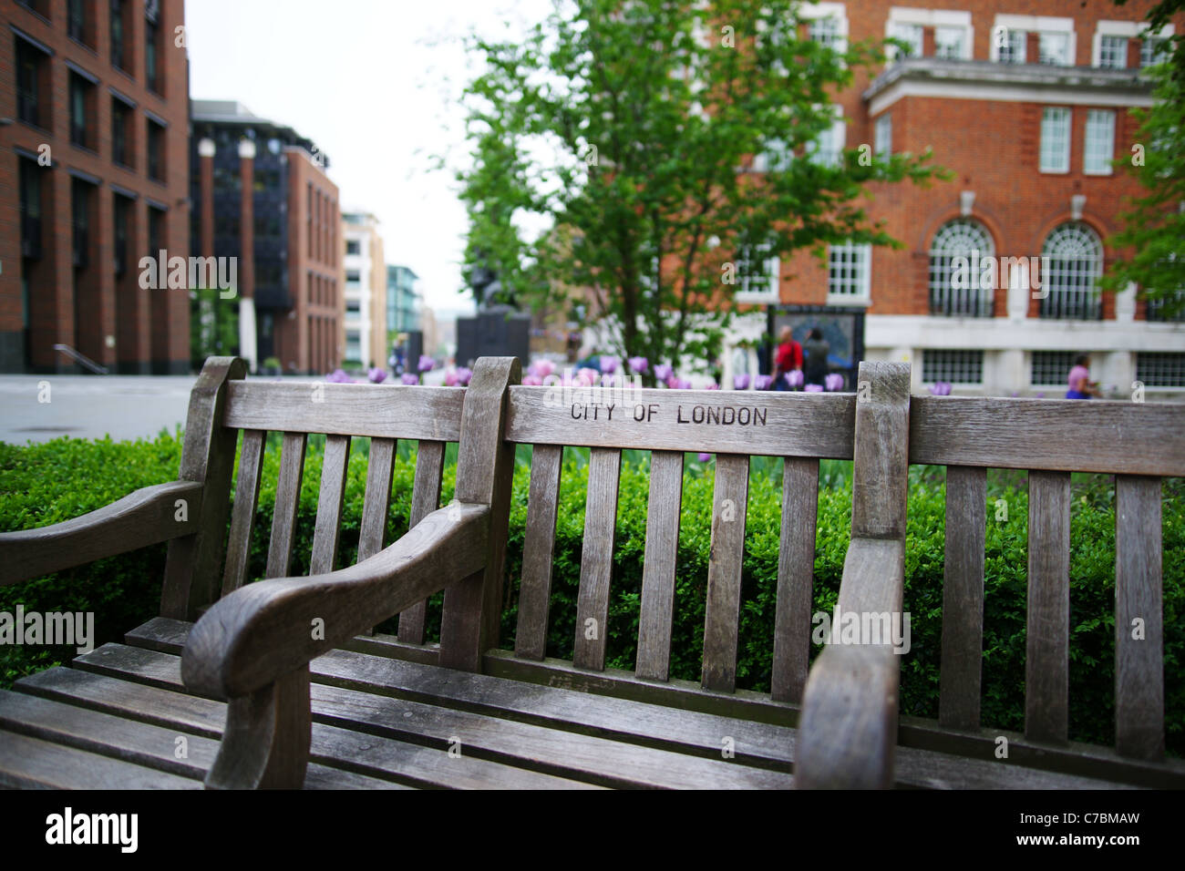 Wooden bench in London city Stock Photo - Alamy