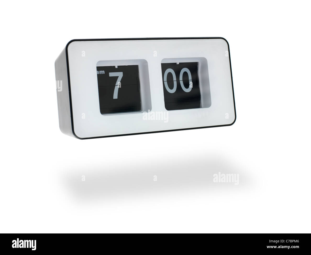 A flip clock isolated against a red background Stock Photo - Alamy