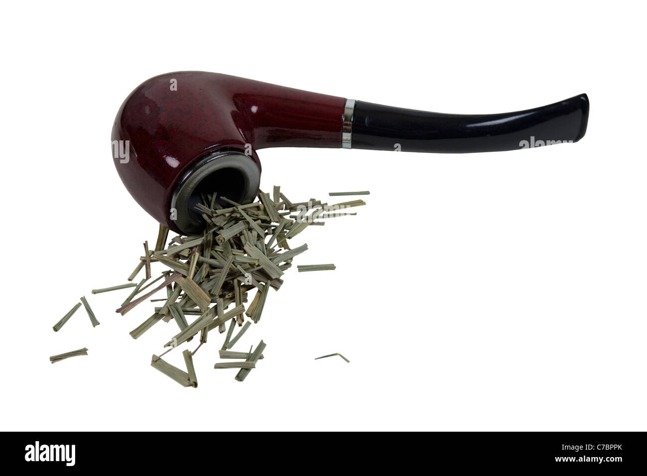 Simple wooden smoking pipe with metal bowl with mysterious green leafy ...