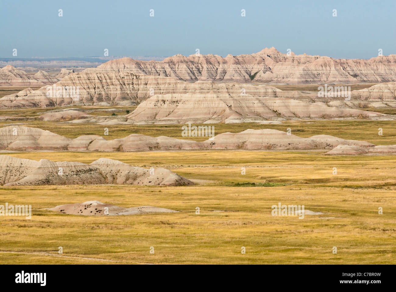 Sculpted spires rise above prairie grasslands in Badlands National Park ...