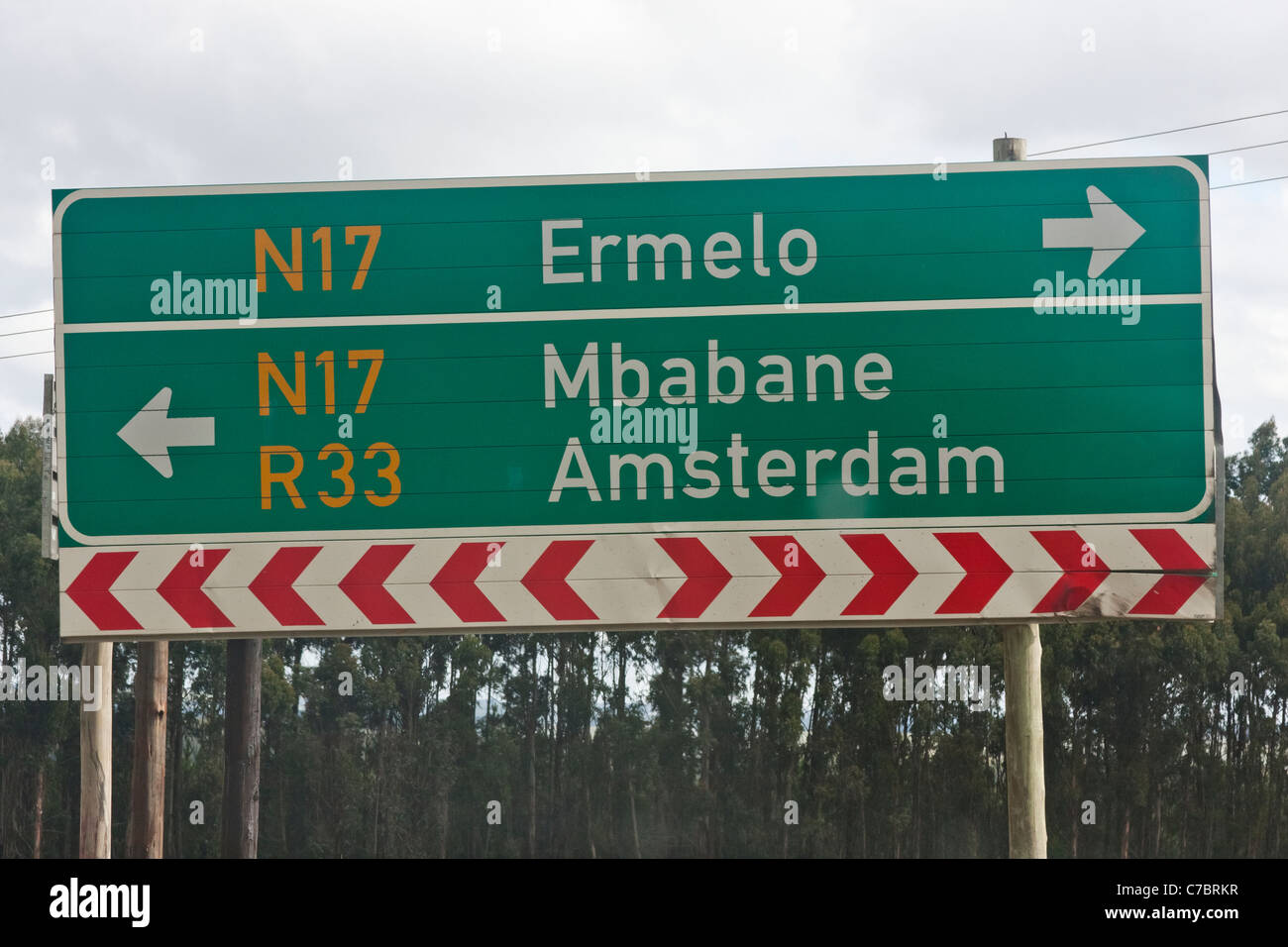 Green and red Road sign at the intersection of N17 and R33 heading from ...