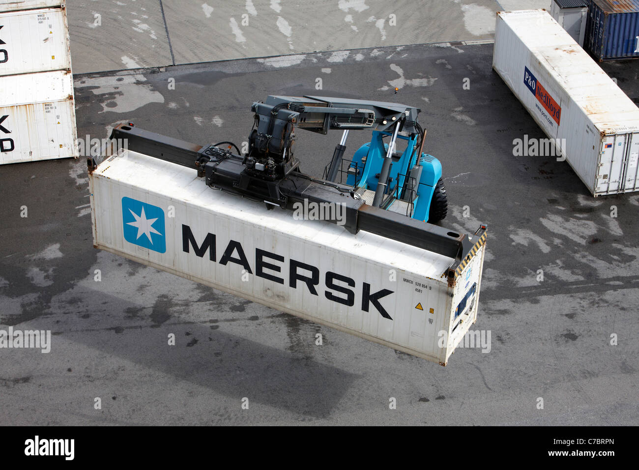 A ship's cargo container being moved in the port of Bergen, Norway ...