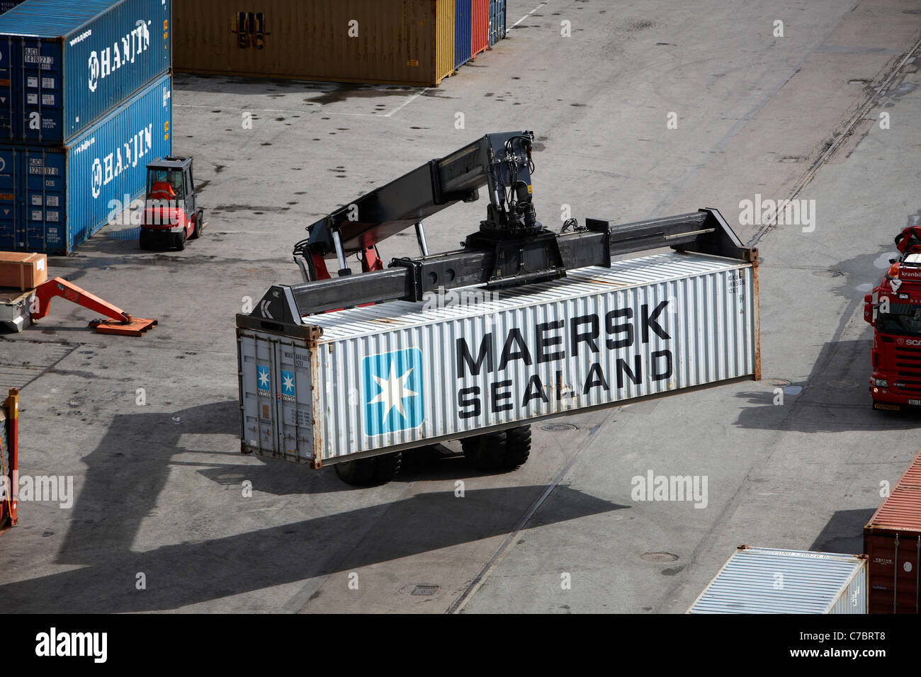 A ship's cargo container being moved in the port of Bergen, Norway ...