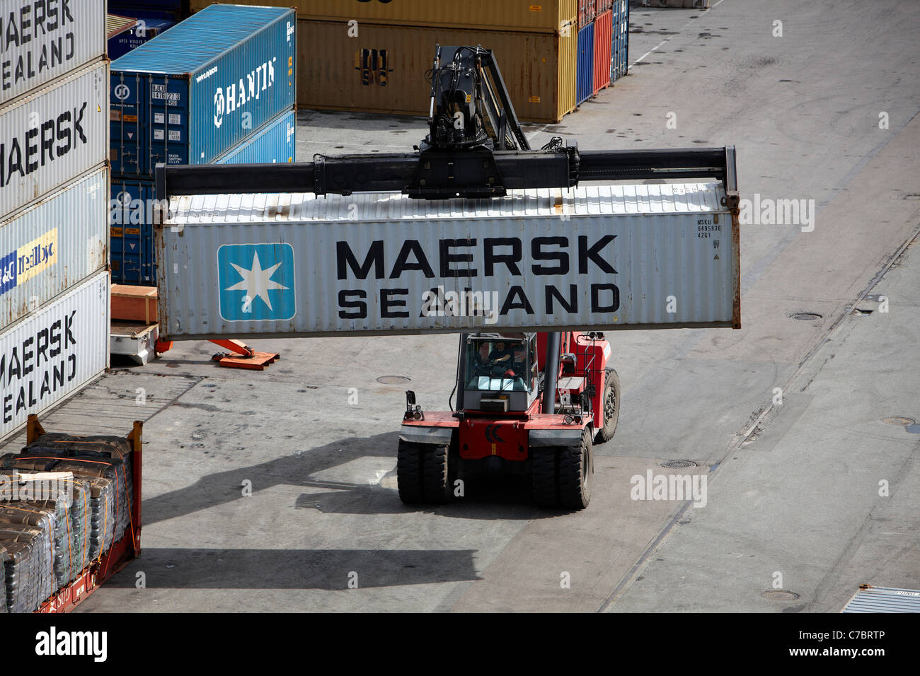 A ship's cargo container being moved in the port of Bergen, Norway ...