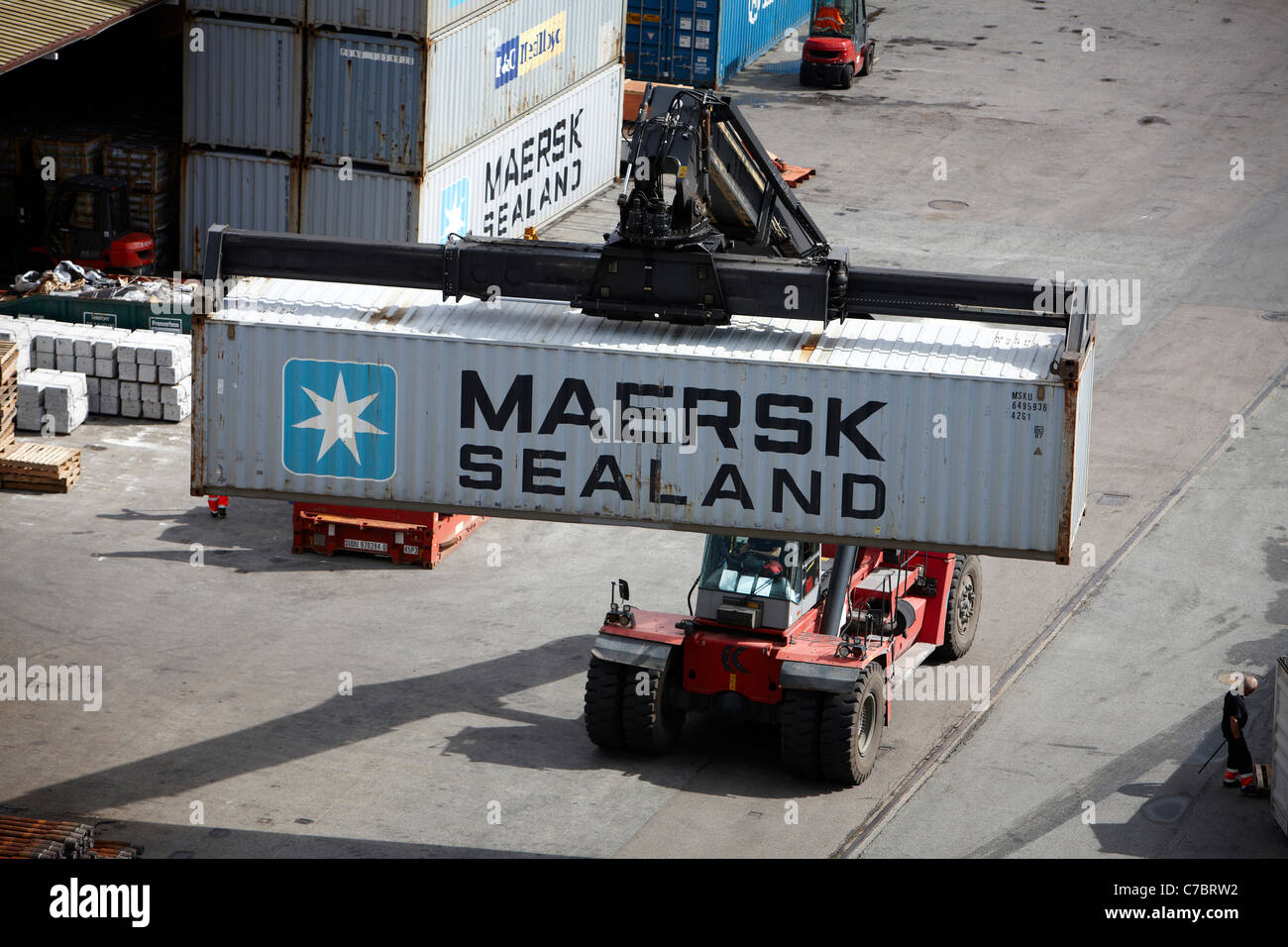 A ship's cargo container being moved in the port of Bergen, Norway ...