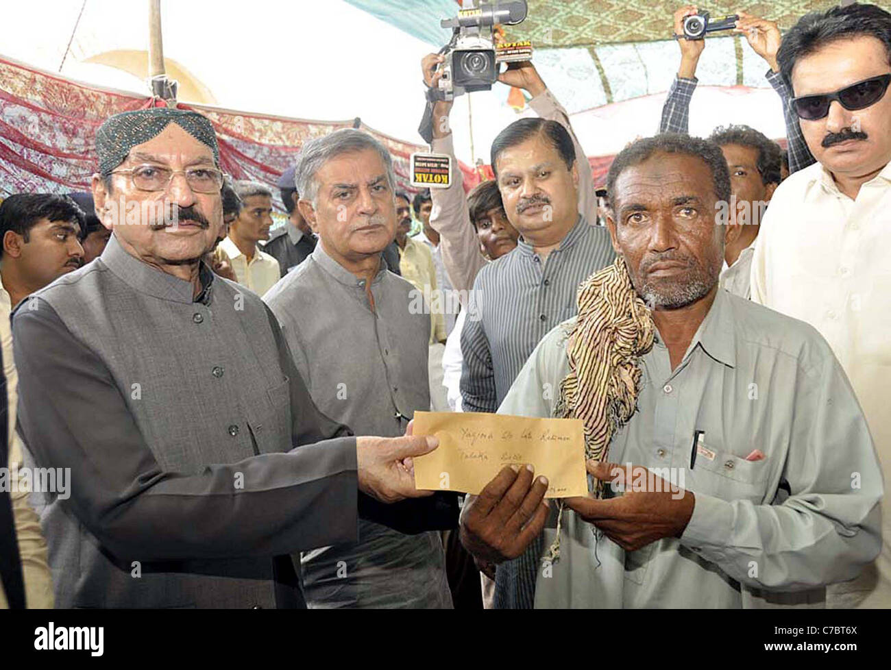 Syed Qaim Ali Shah distributes financial assistance cheques to rain ...