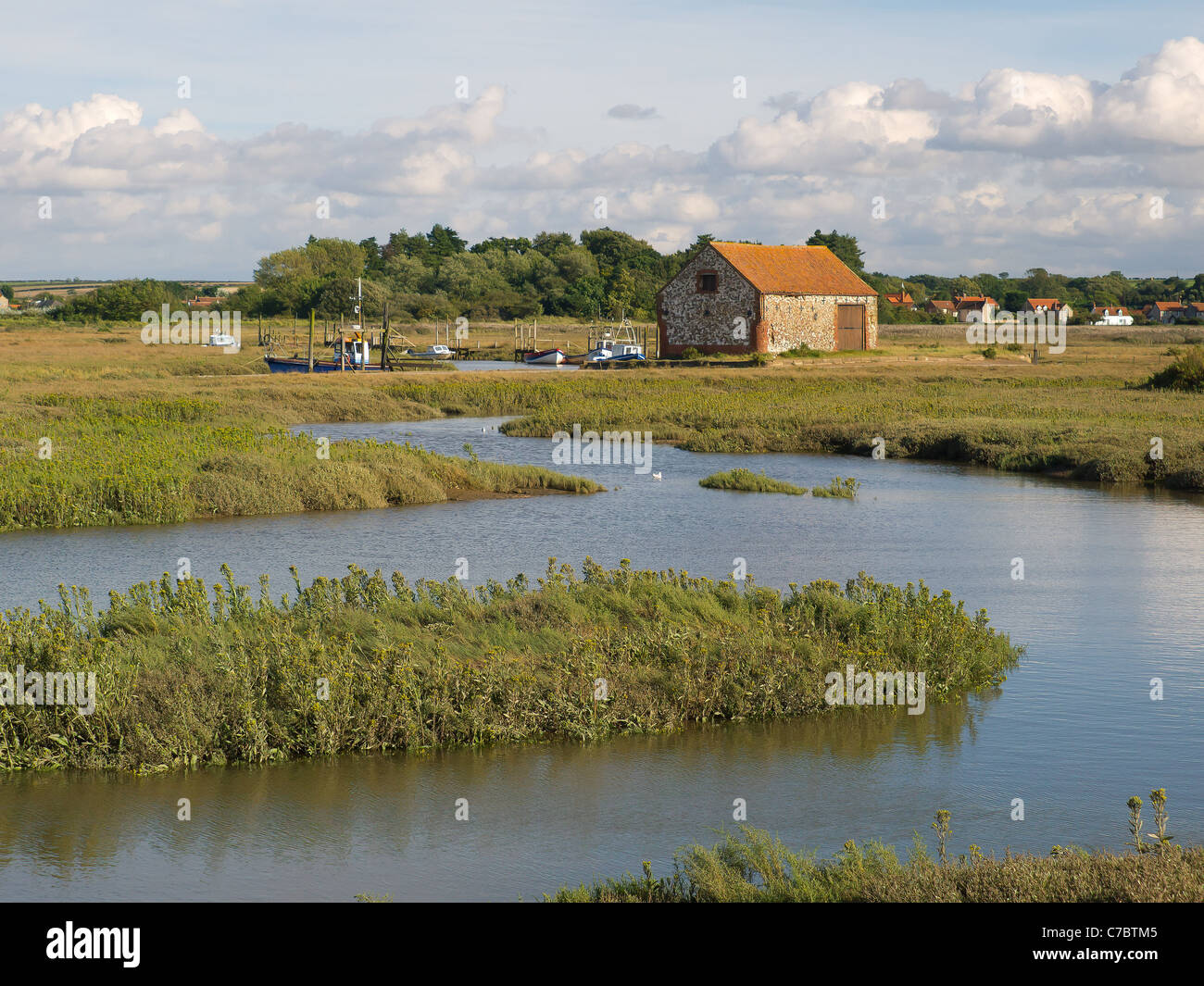 Thornham Village with the Old Coal Barn seen from the Holme Nature ...