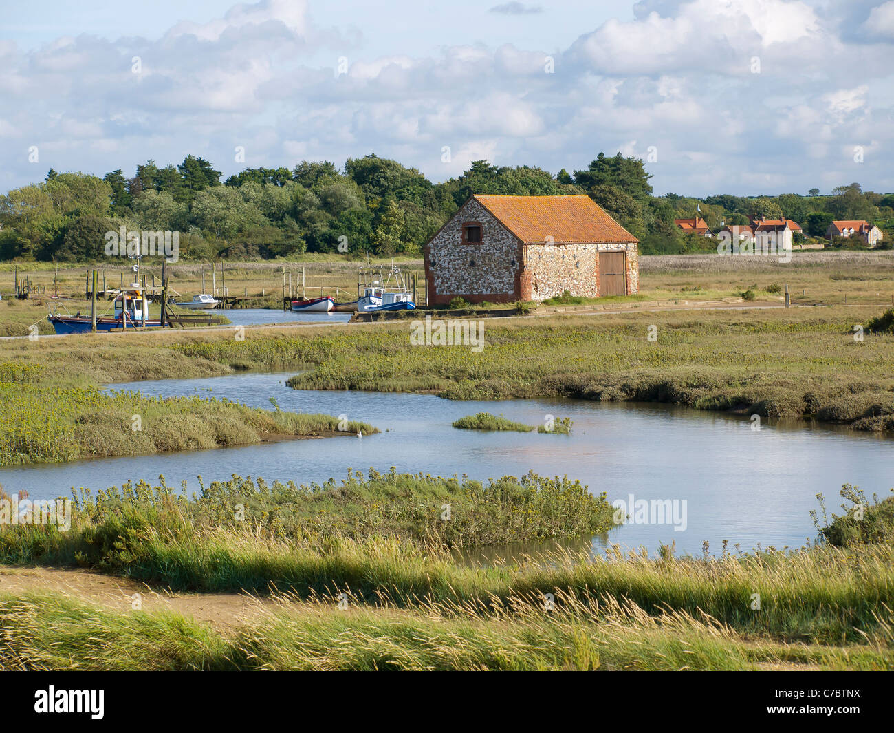 Thornham Village with the Old Coal Barn seen from the Holme Nature ...
