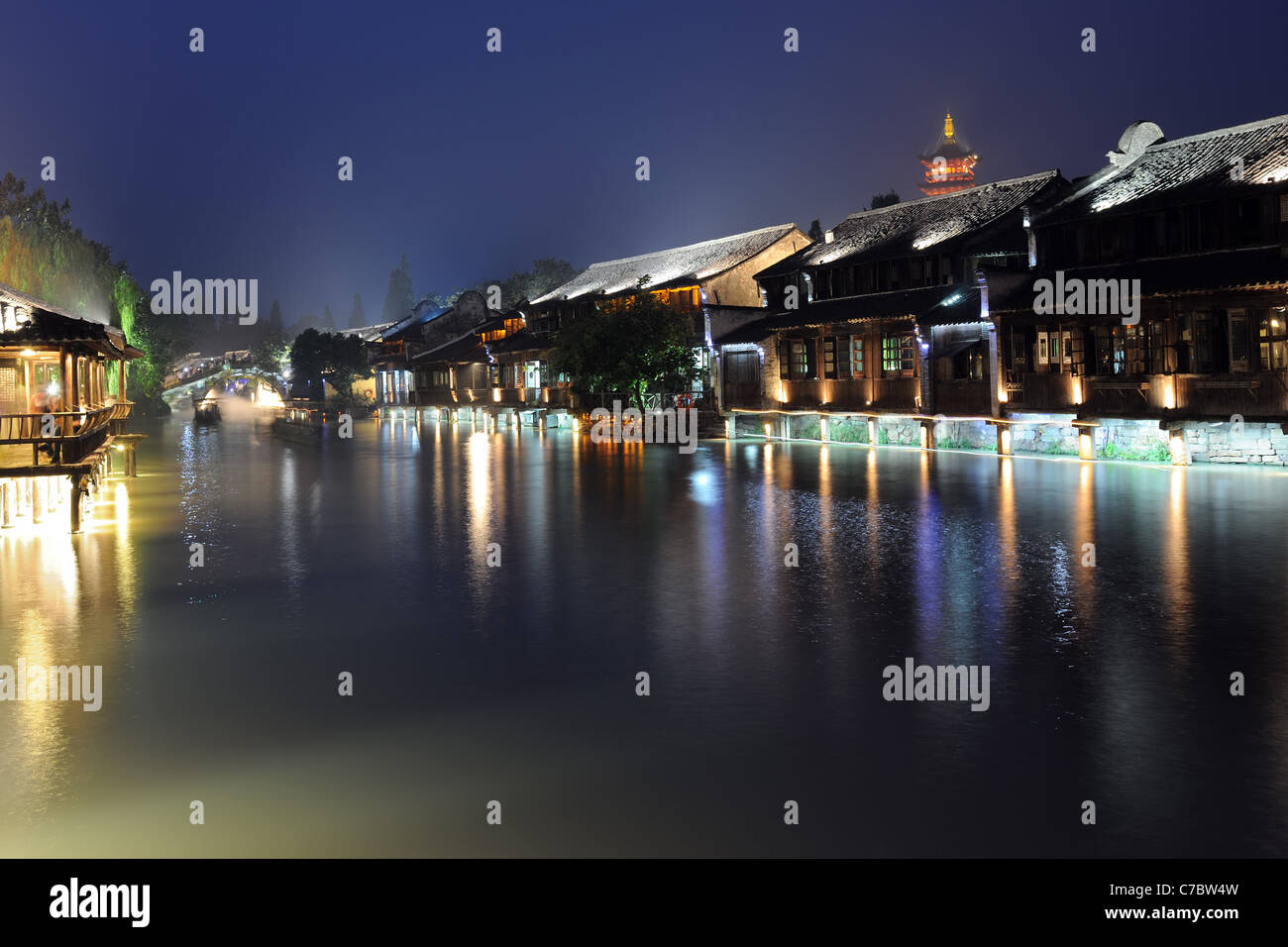Night scene of traditional building near the river in Wuzhen town ...