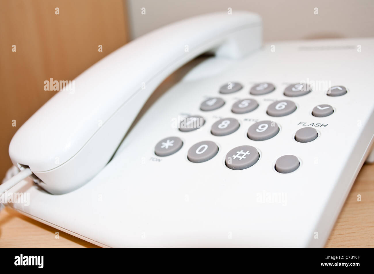 white telephone on desk Stock Photo - Alamy