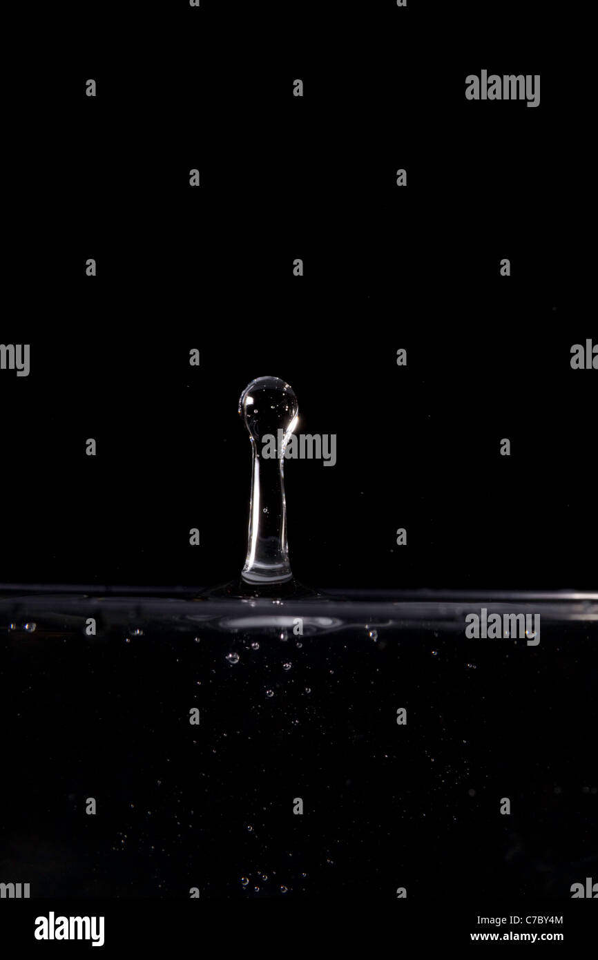 a splash of water above and below the water line with a black ...