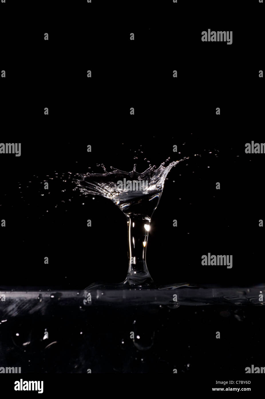 a splash of water above and below the water line with a black ...