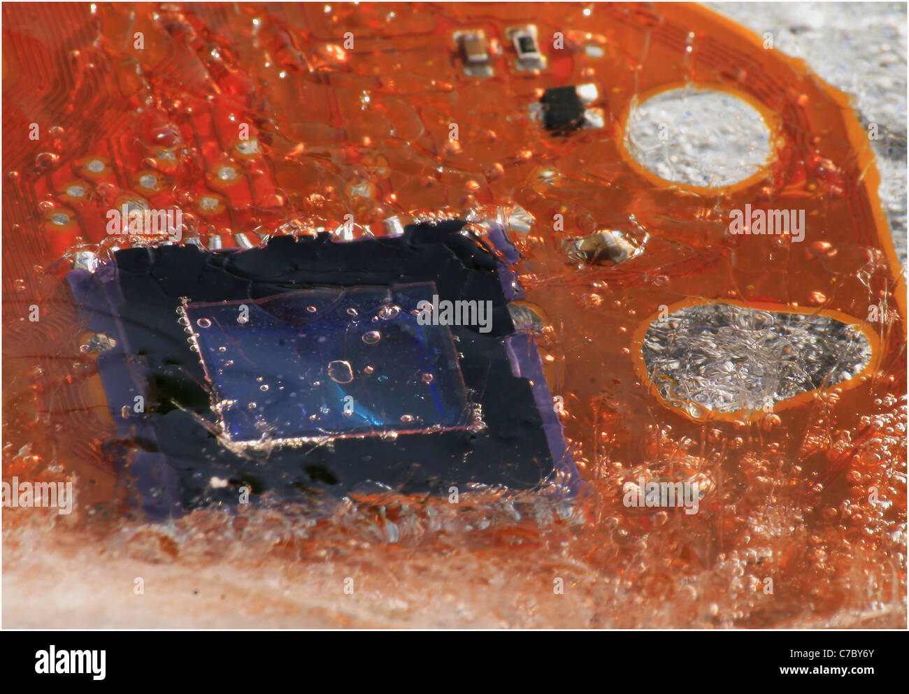 a camera sensor frozen in a block of ice Stock Photo - Alamy