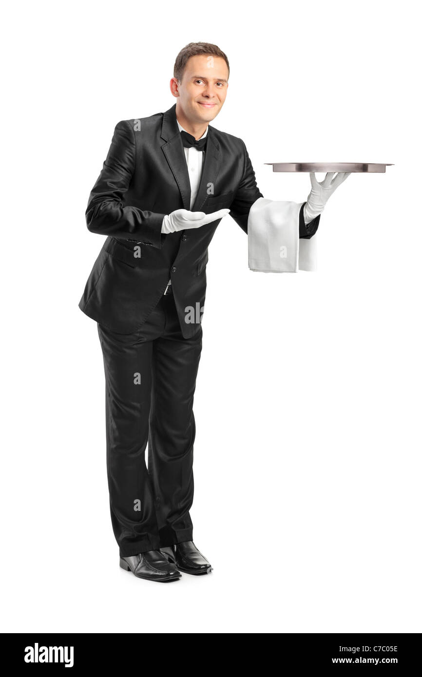 Full length portrait of a butler holding an empty tray Stock Photo - Alamy