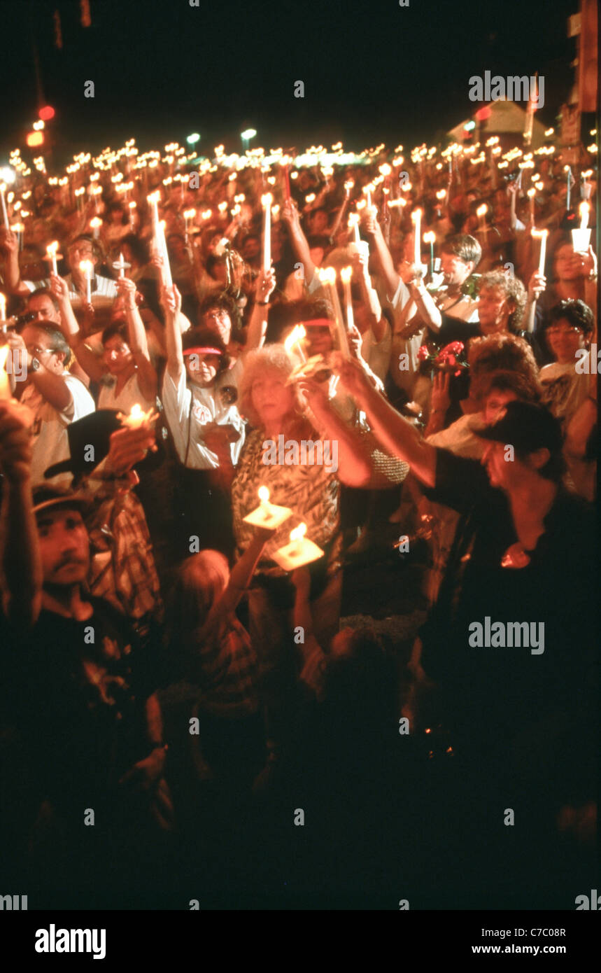 Thousands of Elvis Presley fans hold a candlelight vigil to mark the ...