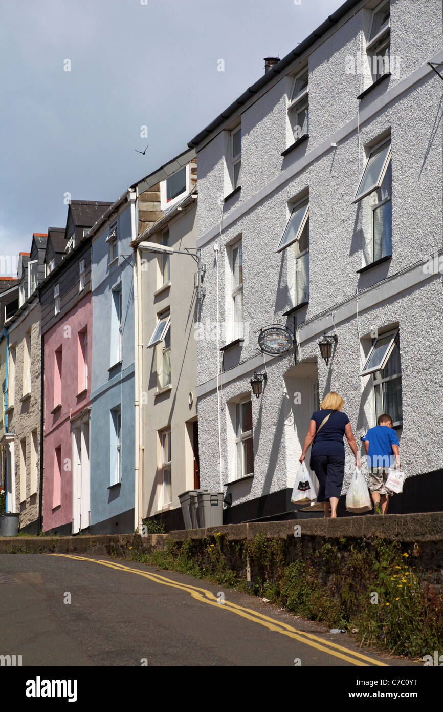 Woman and boy walking up Cross Sreet carrying shopping in Padstow ...