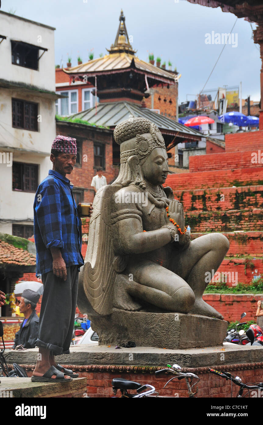 The man standing by the Garud statue at Durbar Square Stock Photo - Alamy