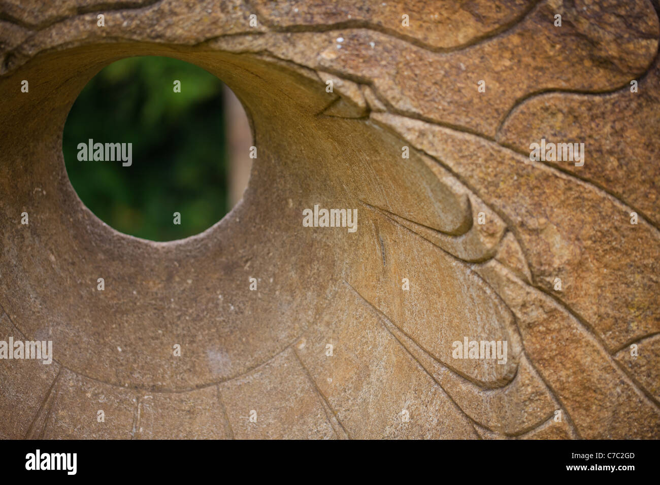 Carved stone with a hole Stock Photo - Alamy