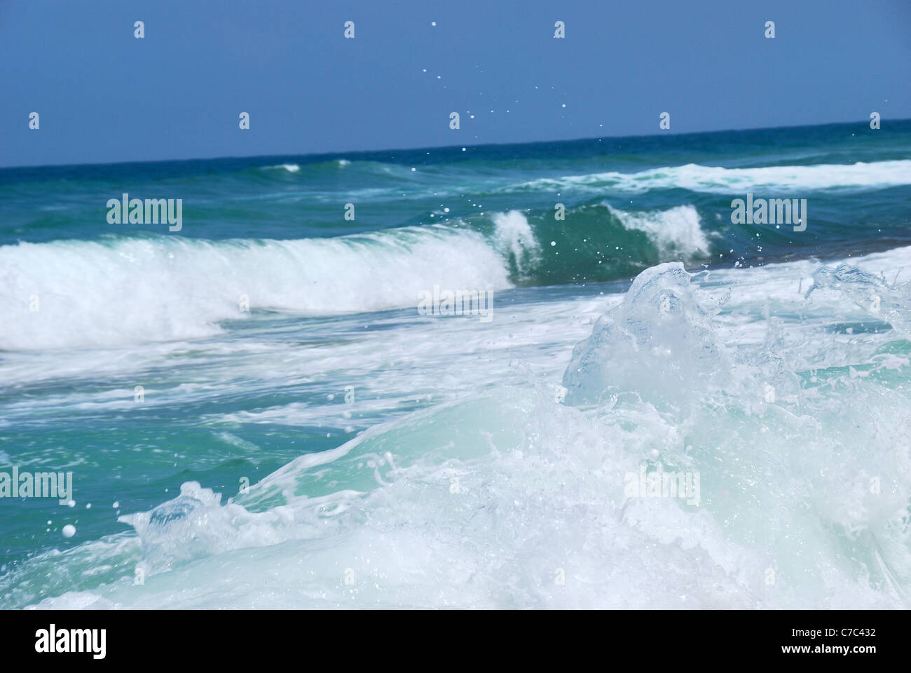 Running waves under the blue sky. Mediterranean sea Stock Photo - Alamy
