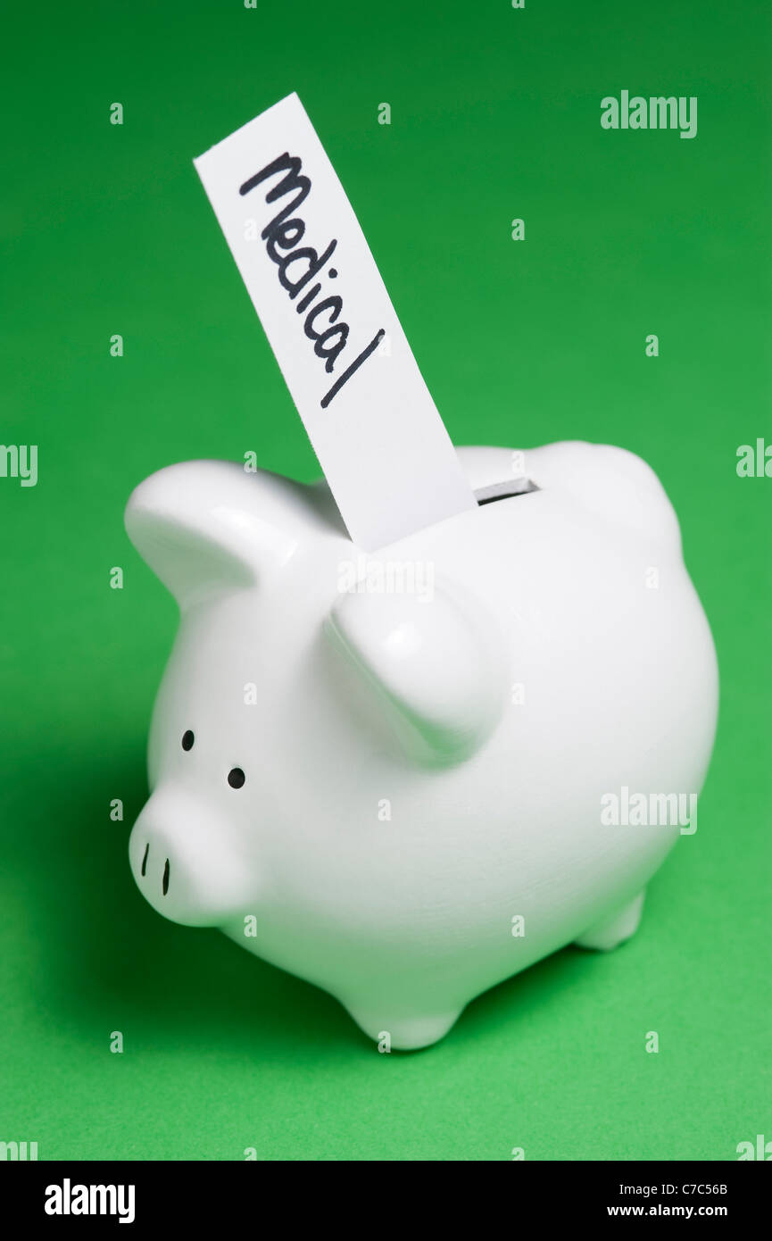 Piggy Bank with medical debt bill coming out of coin slot Stock Photo ...