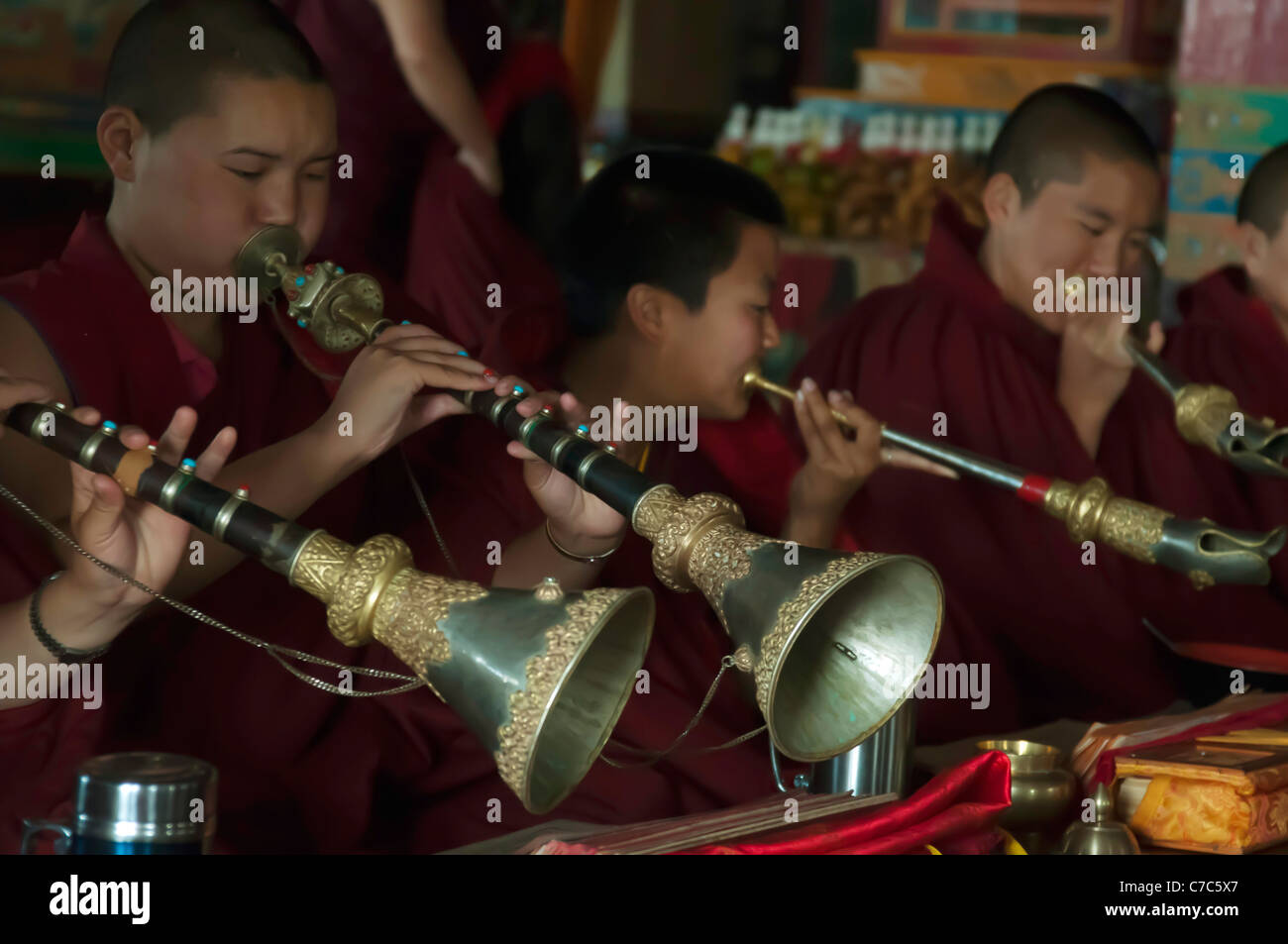 Sherpa Buddhist monks performing ceremonies at the Ani Gumba Monastery ...