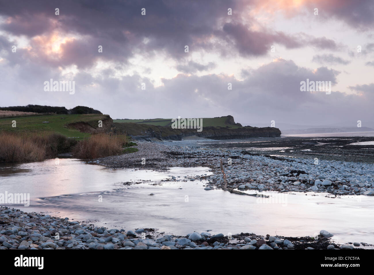 Kilve Pill, , as it flows across Kilve Beach Stock Photo - Alamy