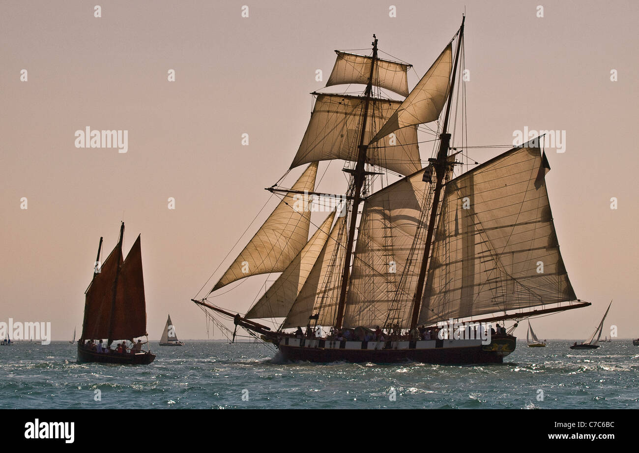 Old schooner sailing at sunset. Bay of Morbihan, Brittany, France ...