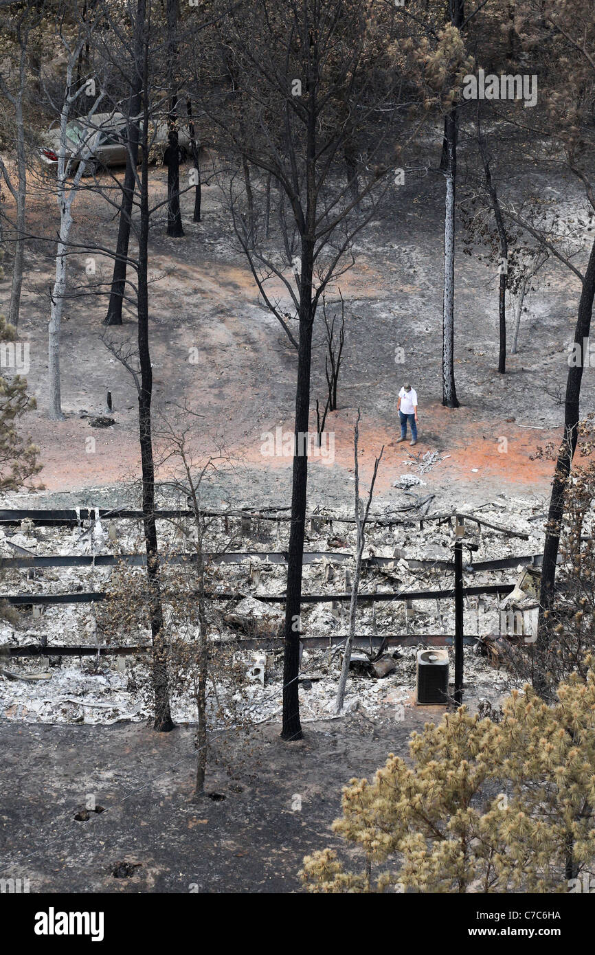 Aerial of wildfire damage in Bastrop County, TX shows foundation of ...