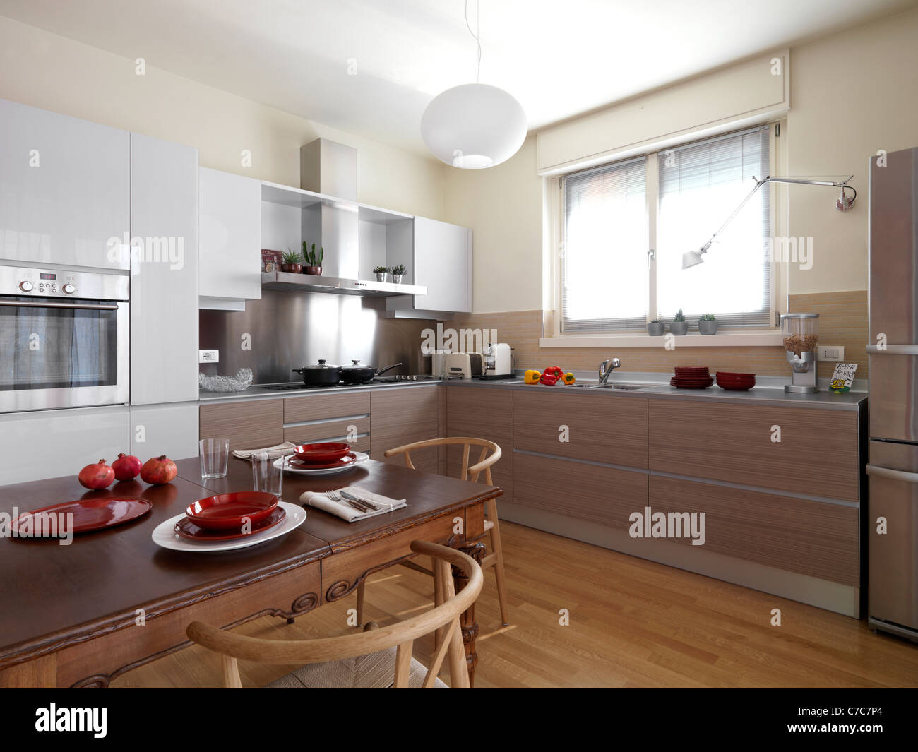 wood modern kitchen with steel appliances and wood floor Stock Photo ...