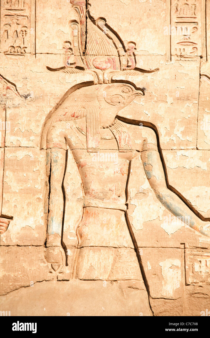 Wall carving depicting the falcon-headed god Horus at the ancient ruins ...